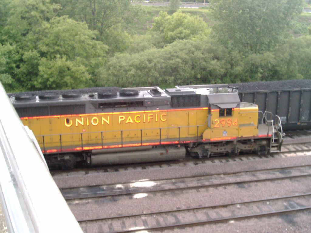 UP SD40-2 2994 idles in the UP yard. Attached to it are two SD70Ms, one in UP colors and one in ...
